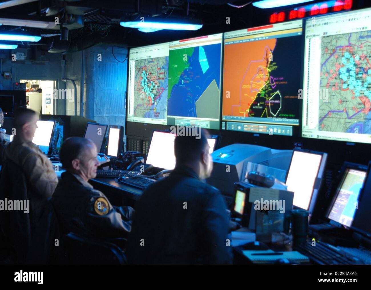 US Navy Joint Operations Center watch standers review the latest battle ...