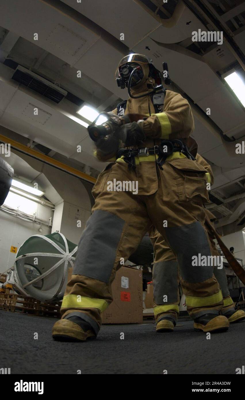 US Navy Hose team members assigned to Repair Locker ''One Bravo Stock ...