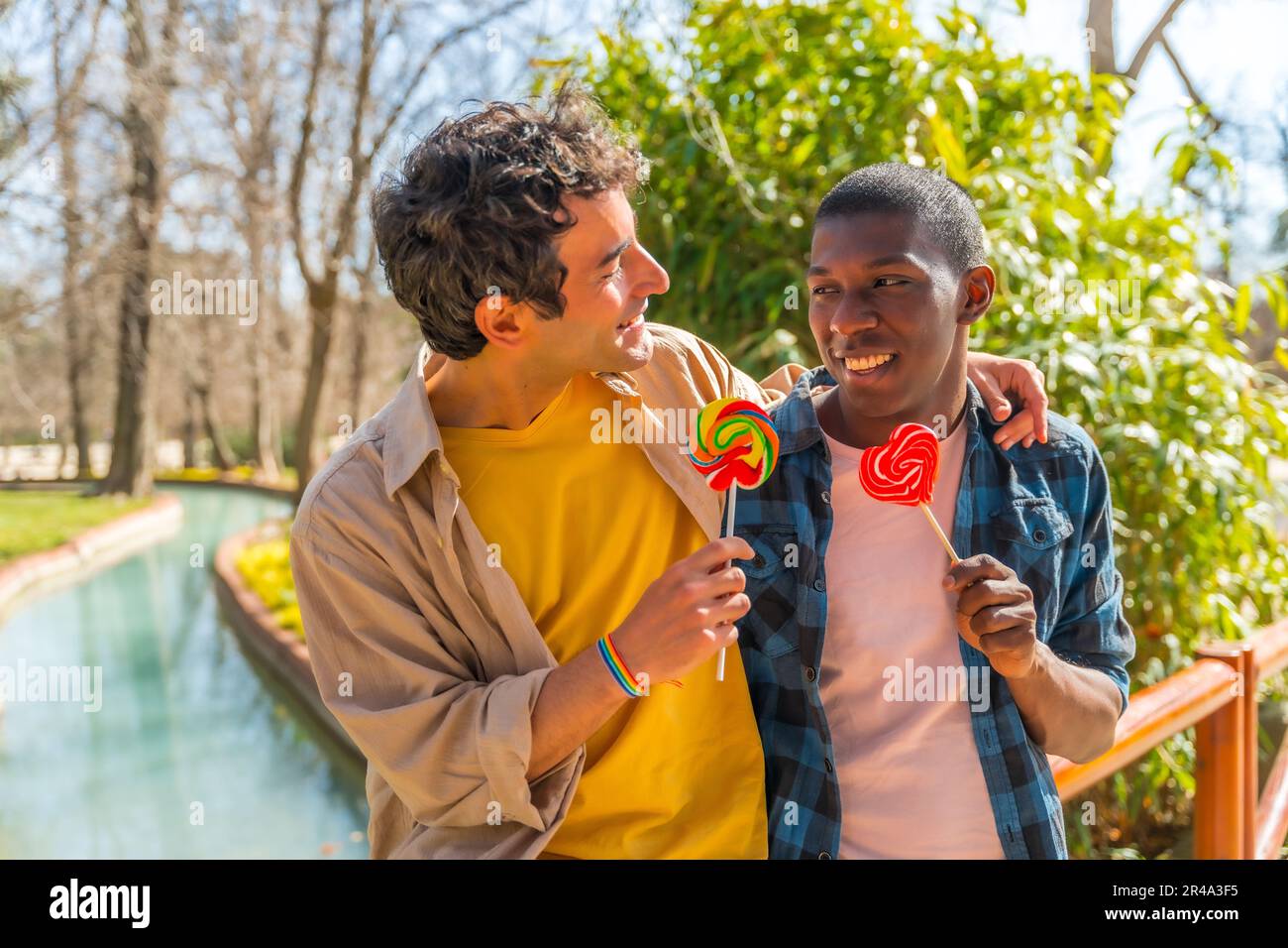 Happy diverse couple embracing smiling hi-res stock photography and ...