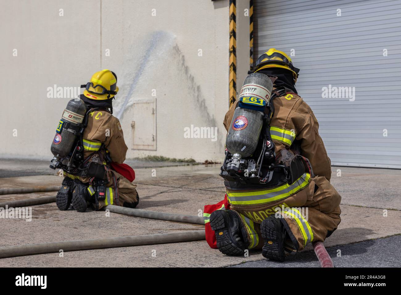 Koya Higa, a firefighter, left, and Michael Madsen, a fire captain ...