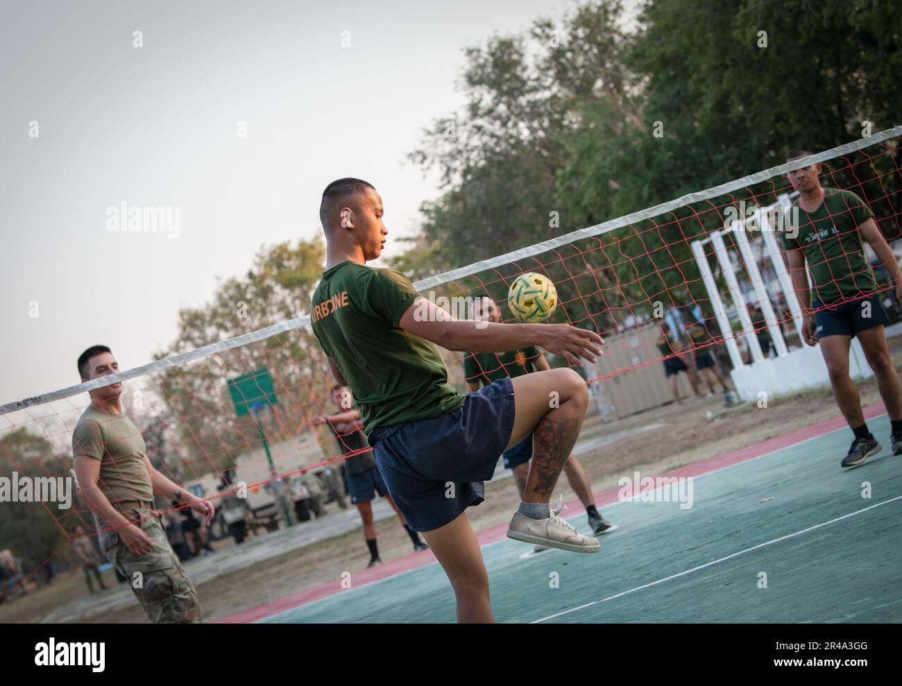 A Royal Thai Army Soldier kicks a rattan ball to U.S. Army Staff Sgt ...