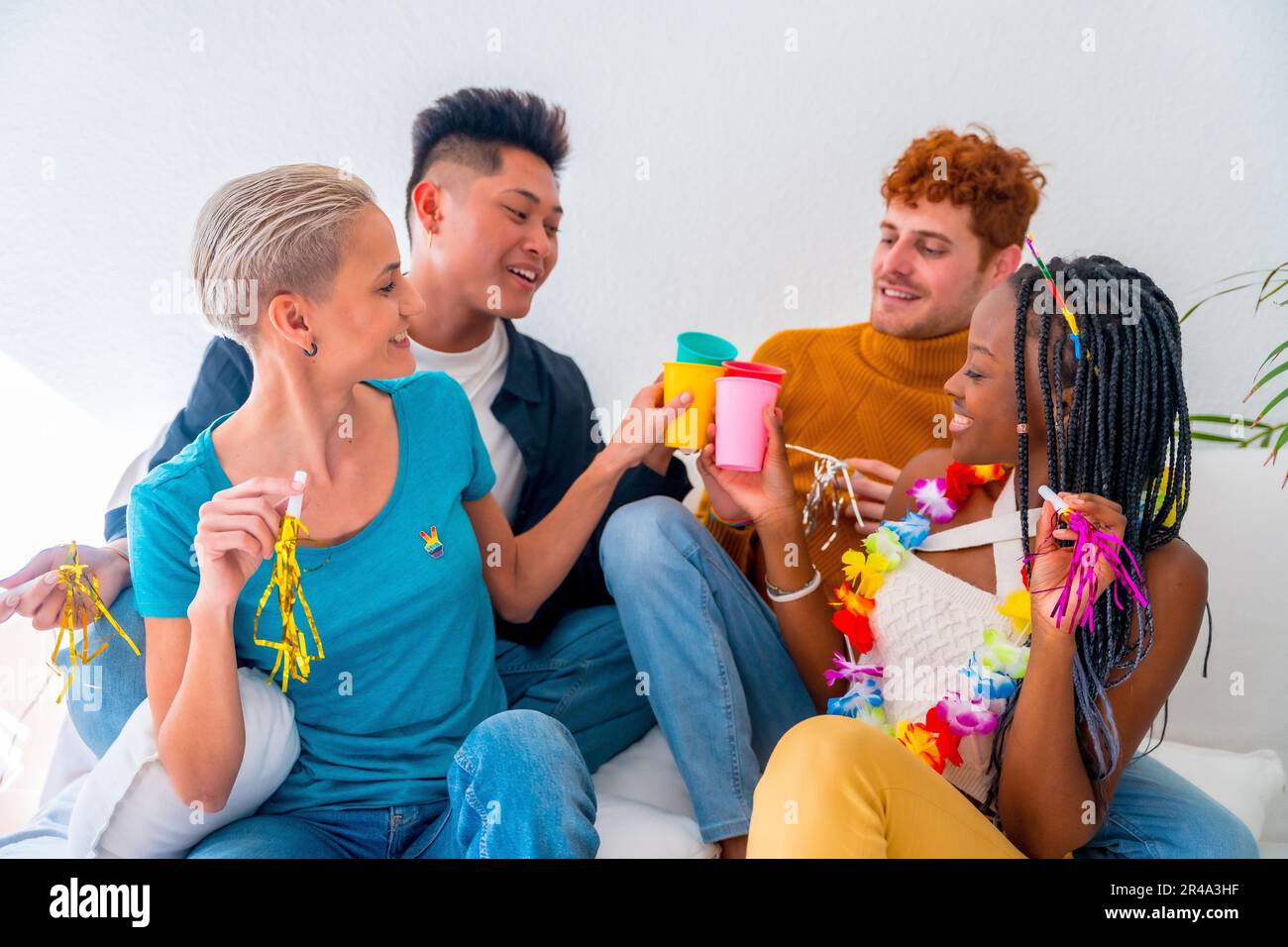 A diverse group of LGBT friends enjoying a relaxed morning in a ...