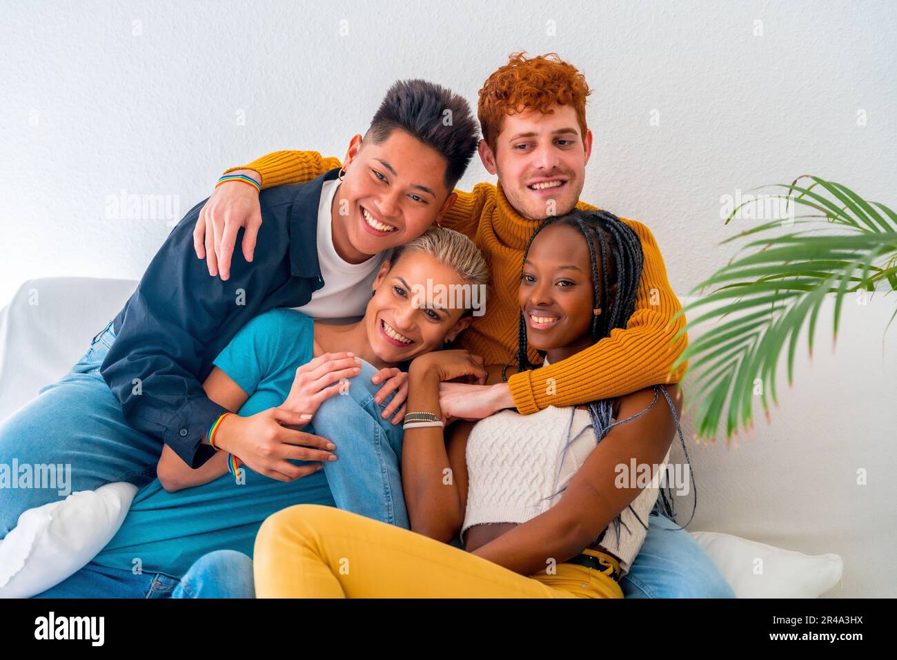 A diverse group of LGBT friends enjoying a relaxed morning in a ...