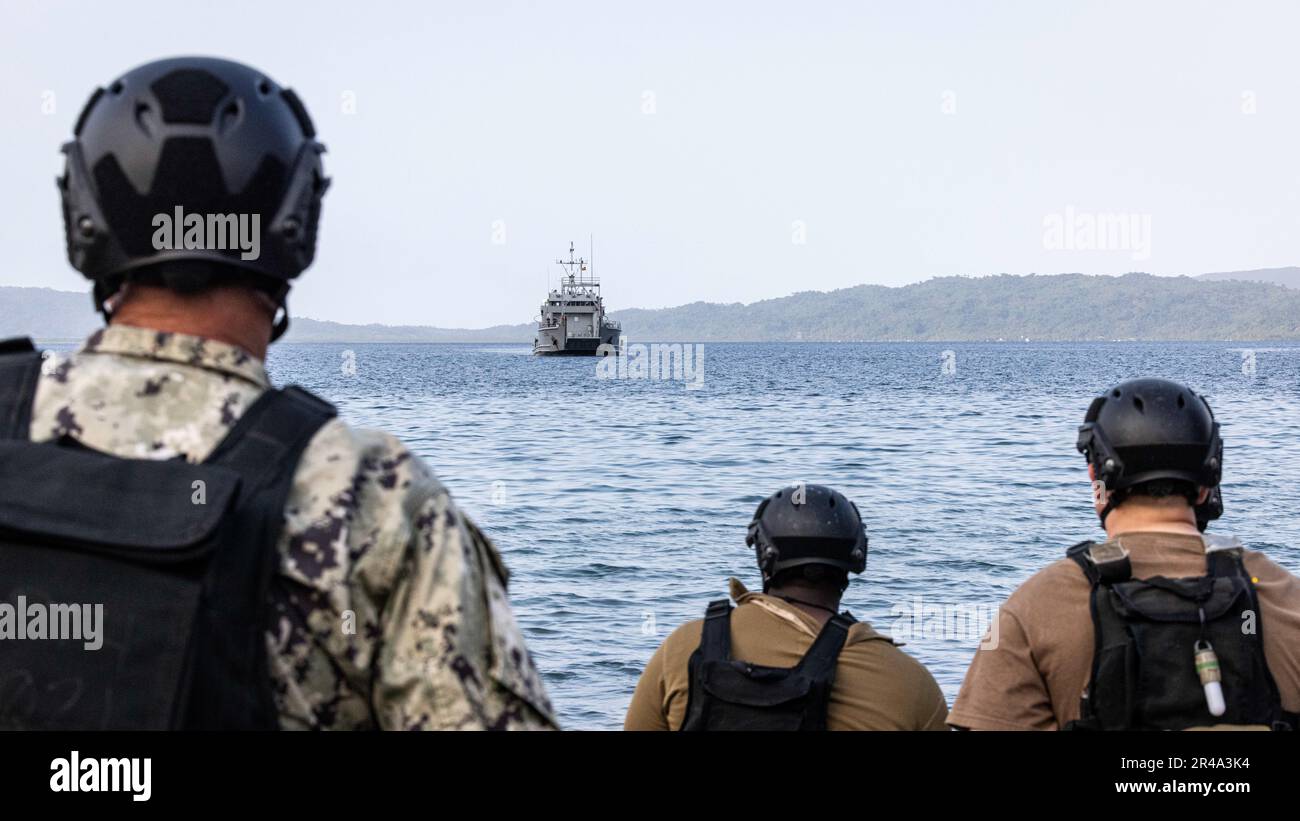 U.S. Navy Sailors with Beachmaster Unit 1, observe an Army Landing ...