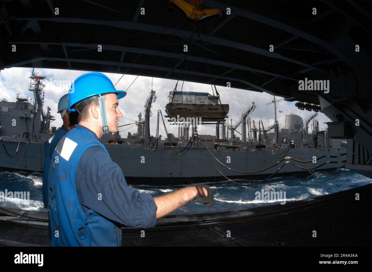 US Navy While conducting an underway replenishment, Boatswain's Mates ...