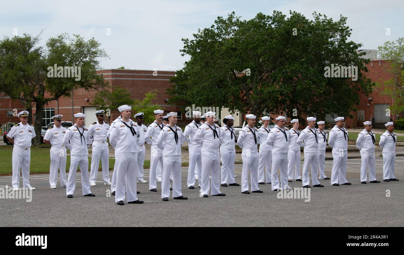 Sailors assigned to NMOTC headquarters stand in formation during a ...