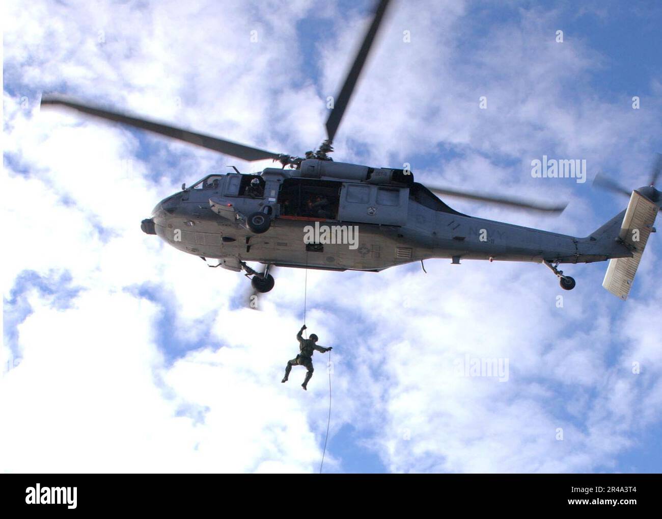 US Navy A member from Explosive Ordnance Disposal Mobile Unit Three ...