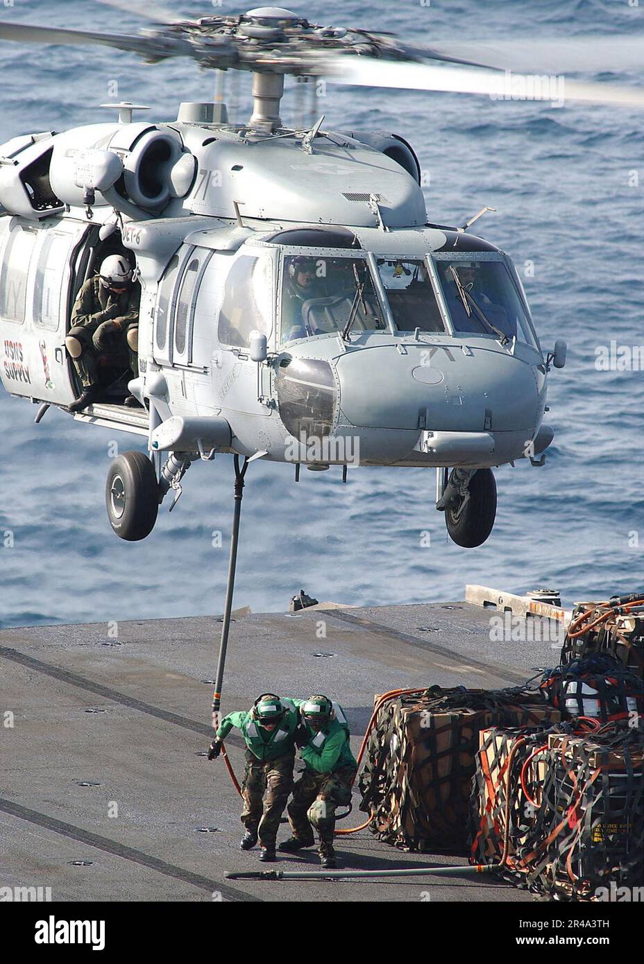 US Navy An MH-60S Knighthawk assigned to the Chargers of Helicopter Combat Support Squadron Six ...