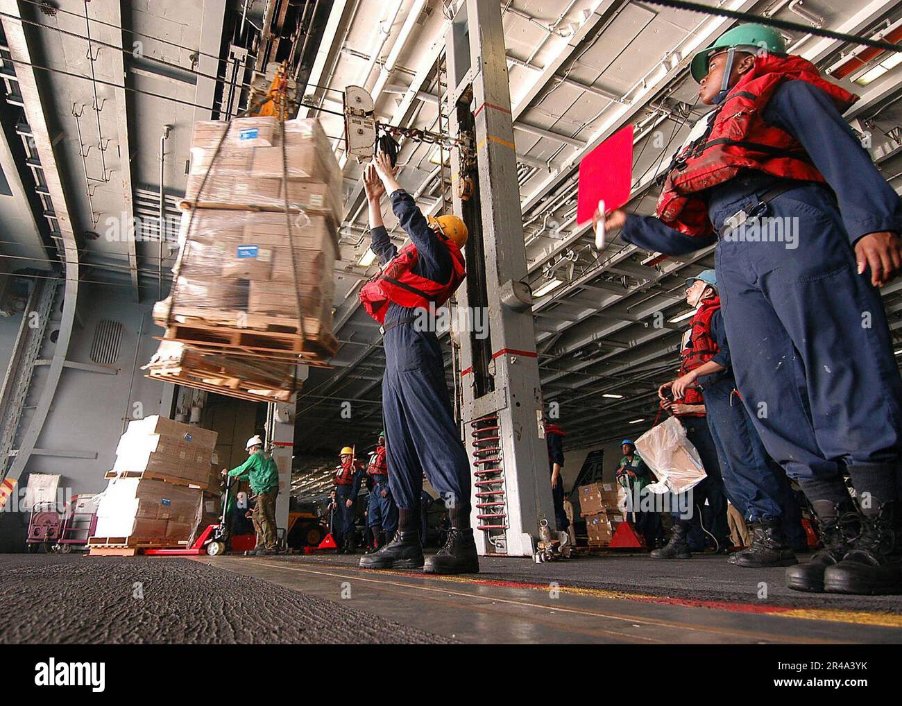 US Navy Deck Department crewmembers receive stores from the fast combat ...