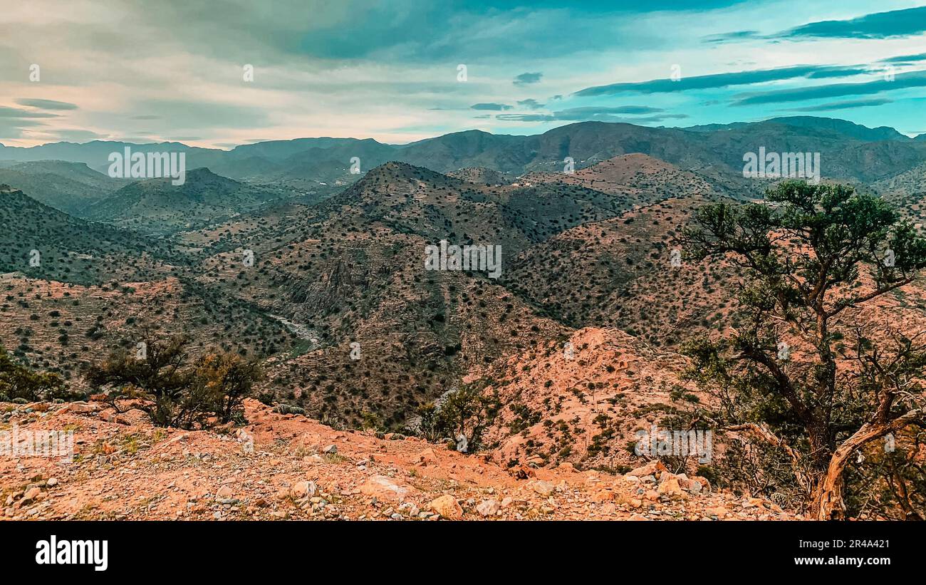A scenic landscape view featuring trees, rocks and bushes in Morocco ...