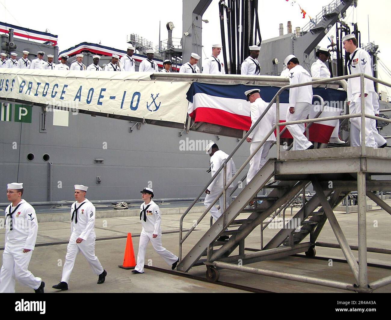 US Navy U.S. Navy Sailors disembark the fast-combat support ship USS Bridge (AOE 10) for the ...