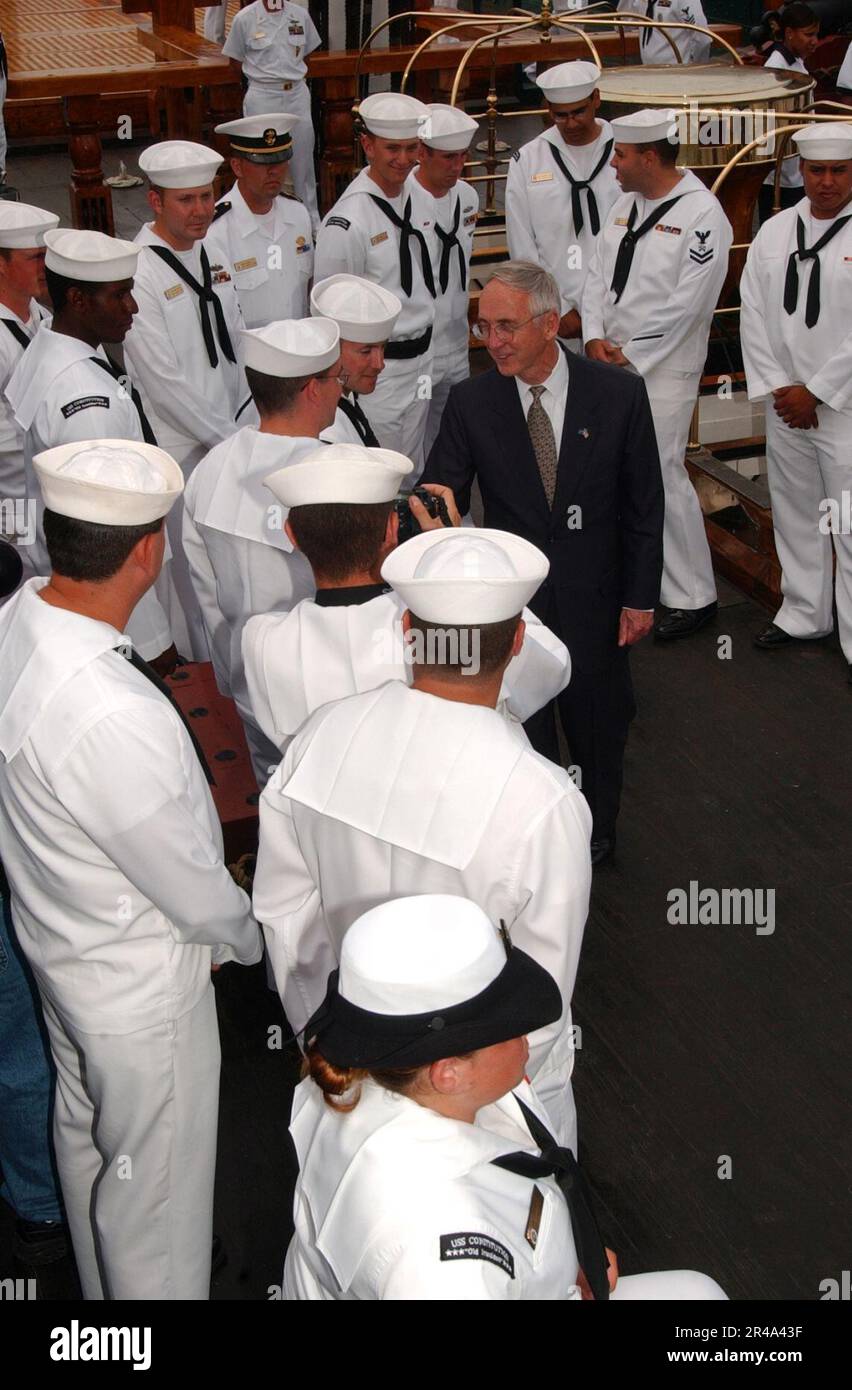US Navy Secretary of the Navy, Gordon R. England greets the crew of USS ...
