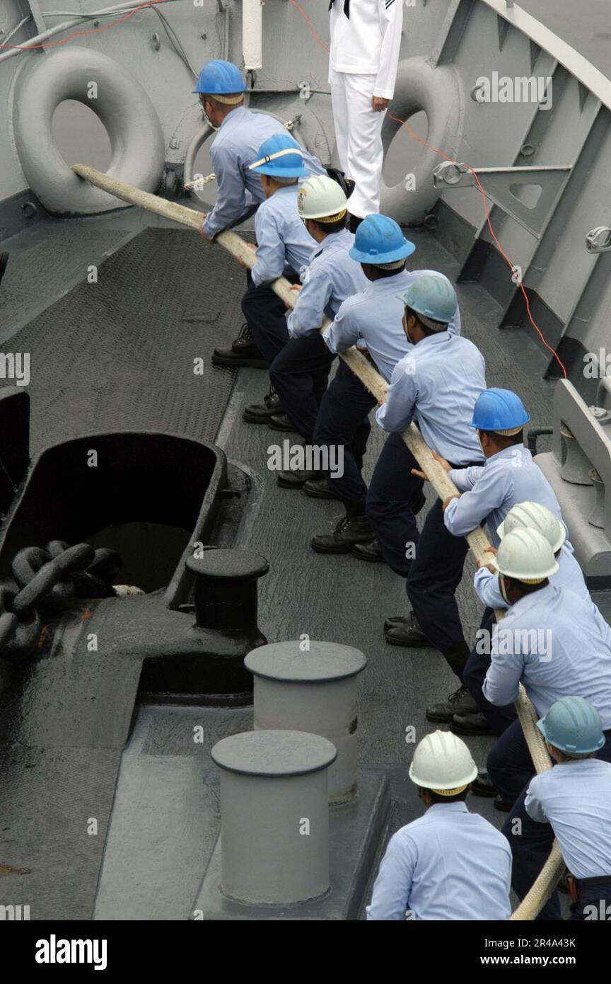 US Navy Sailors assigned to Deck Department's 1st Division take in a ...