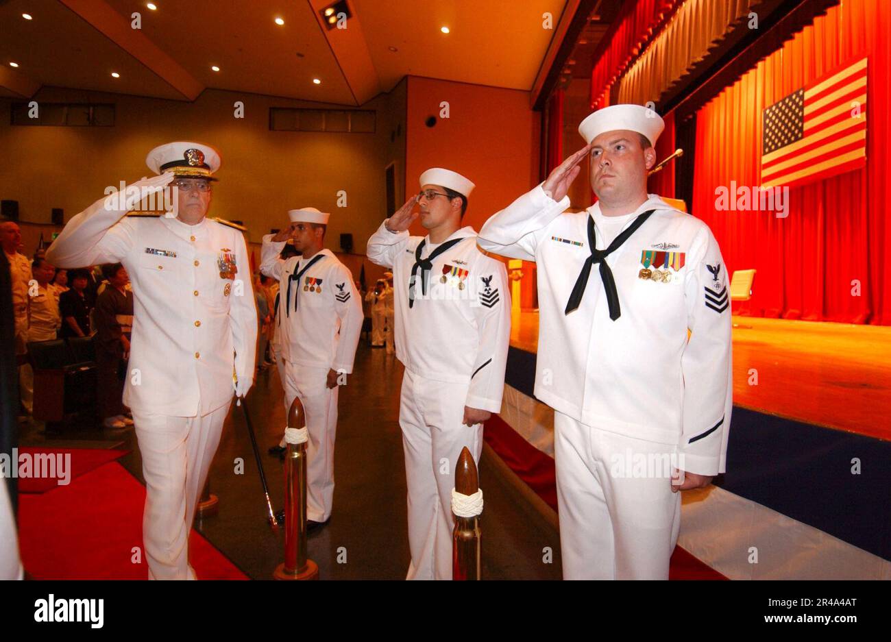US Navy Rear Adm. David A. Gove is piped aboard while passing through ...