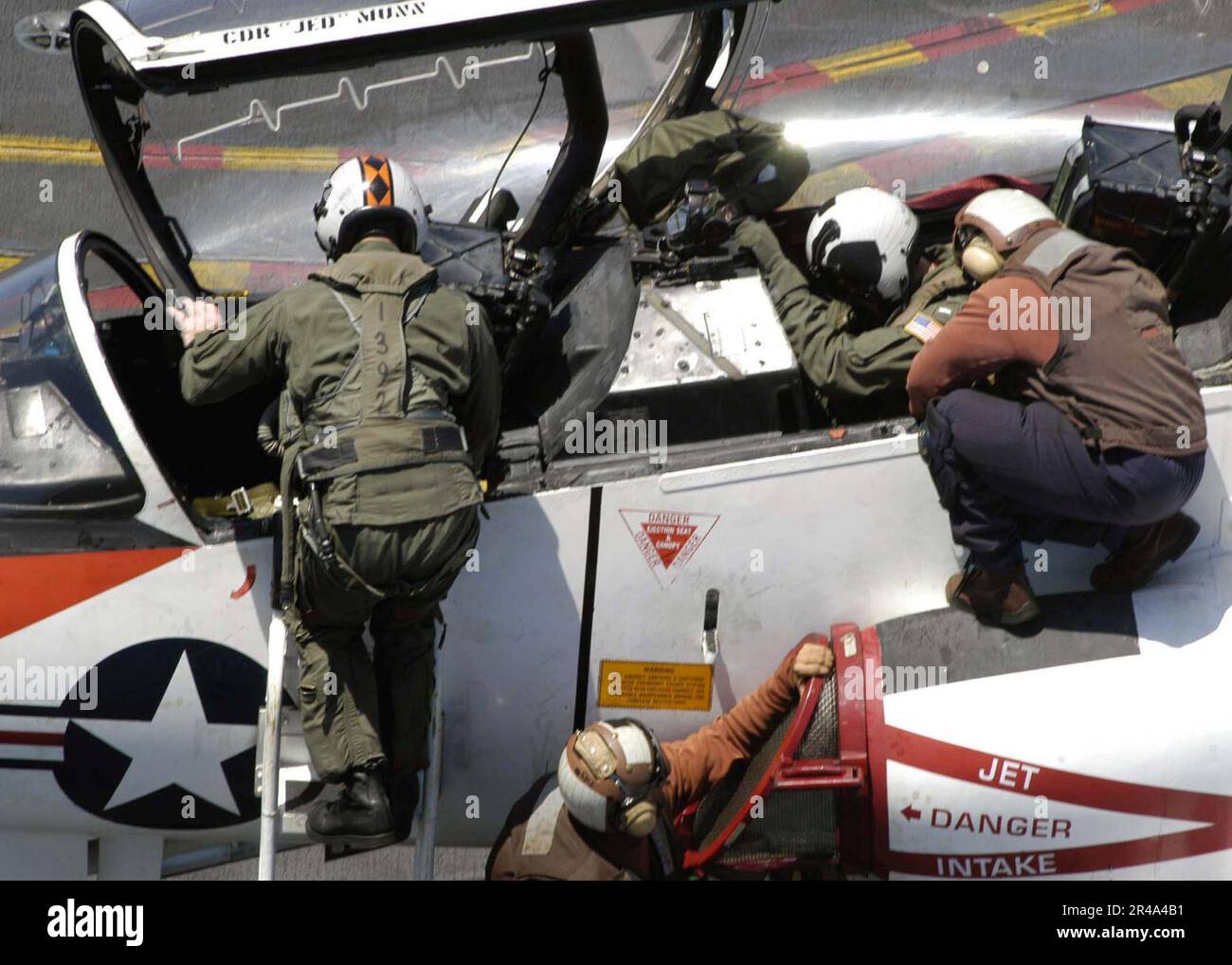 US Navy Student Pilots prepare to exit a T-45C Goshawk during flight ...