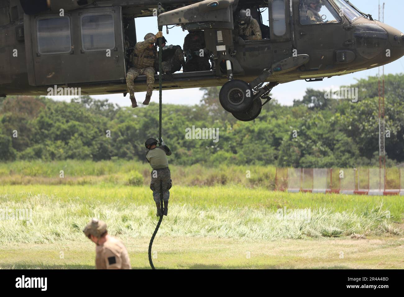 Guatemalan Naval Special Forces fast rope from a UH60 Blackhawk for ...