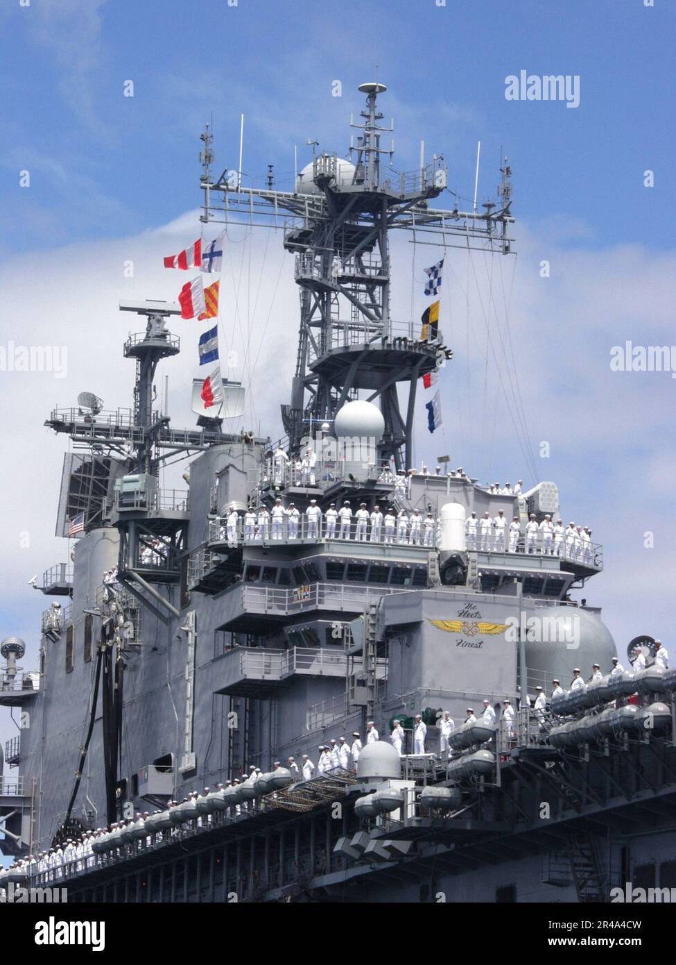US Navy Sailors aboard the amphibious assault ship USS Tarawa (LHA 1 ...