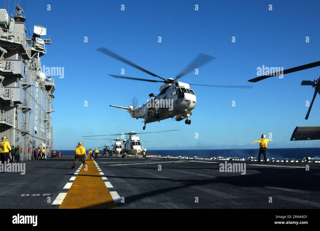 US Navy A UH-3H Sea King helicopter takes off from the flight deck of ...