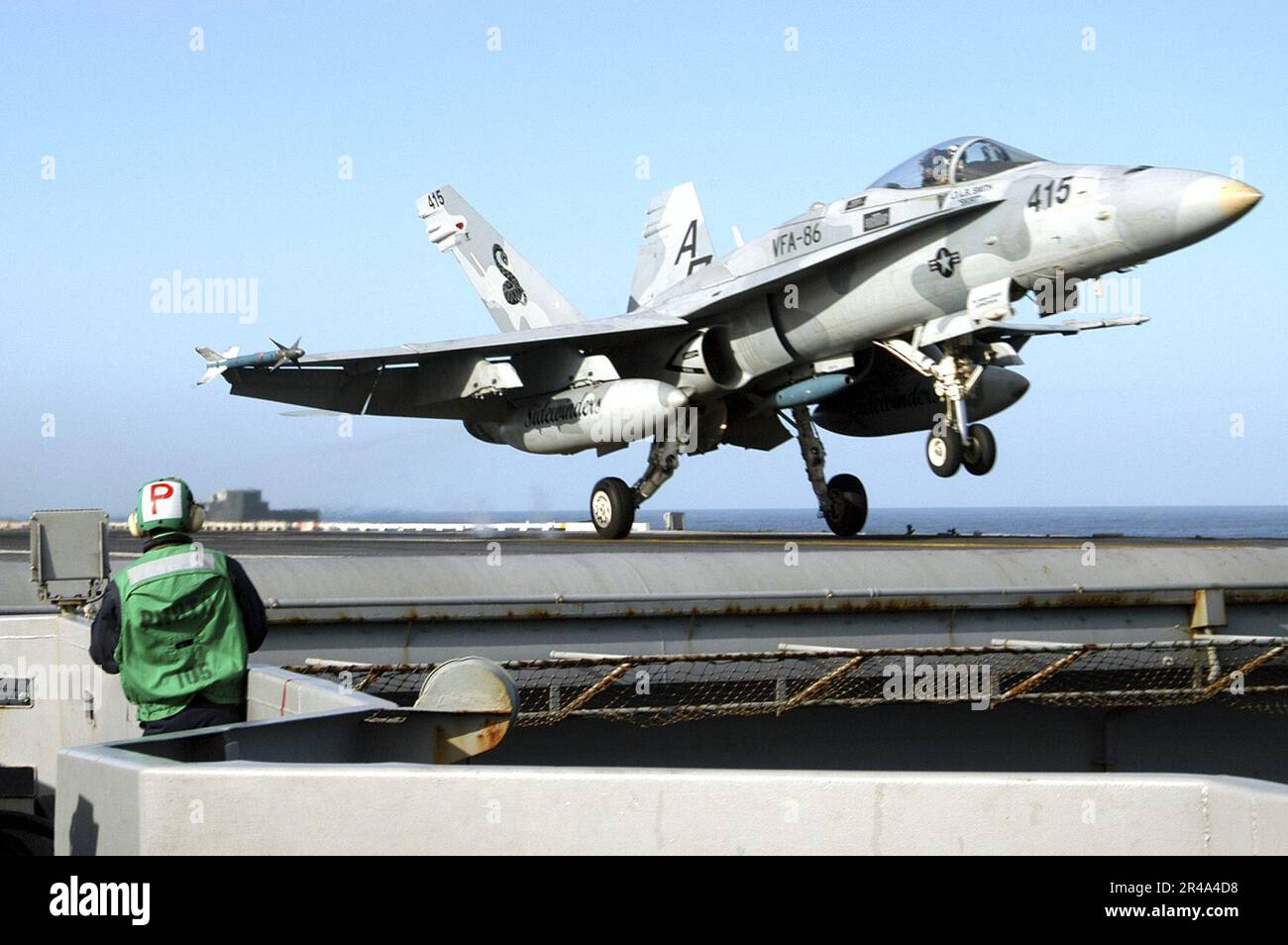 US Navy An F-A-18 Hornet launches back into the air after conducting a ...