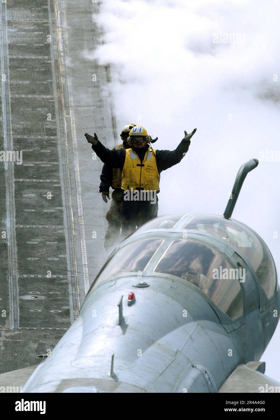 US Navy An aircraft director signals the pilot of an EA-6B Prowler ...