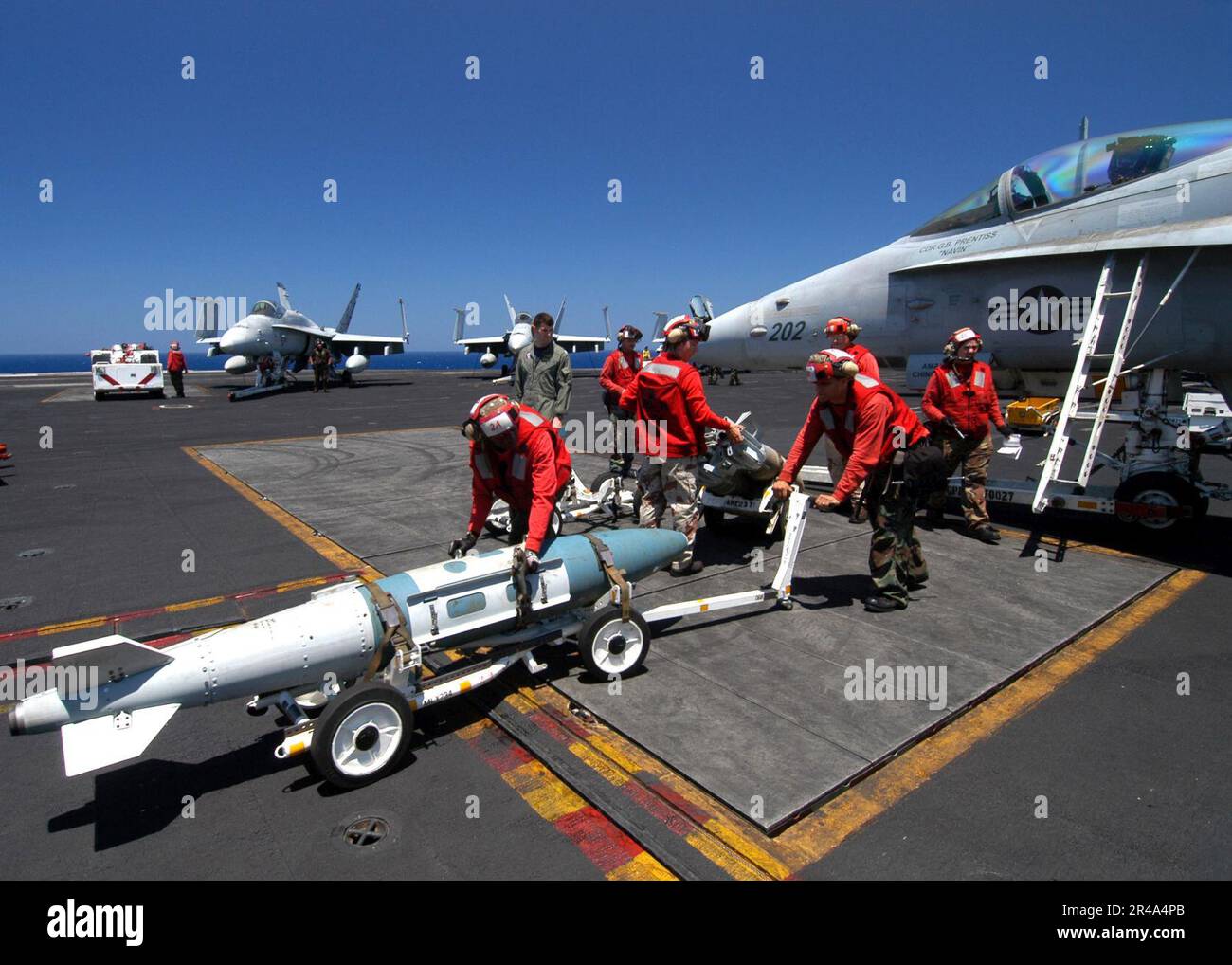 US Navy Aviation Ordnancemen assigned to the Blue Blasters of Strike ...
