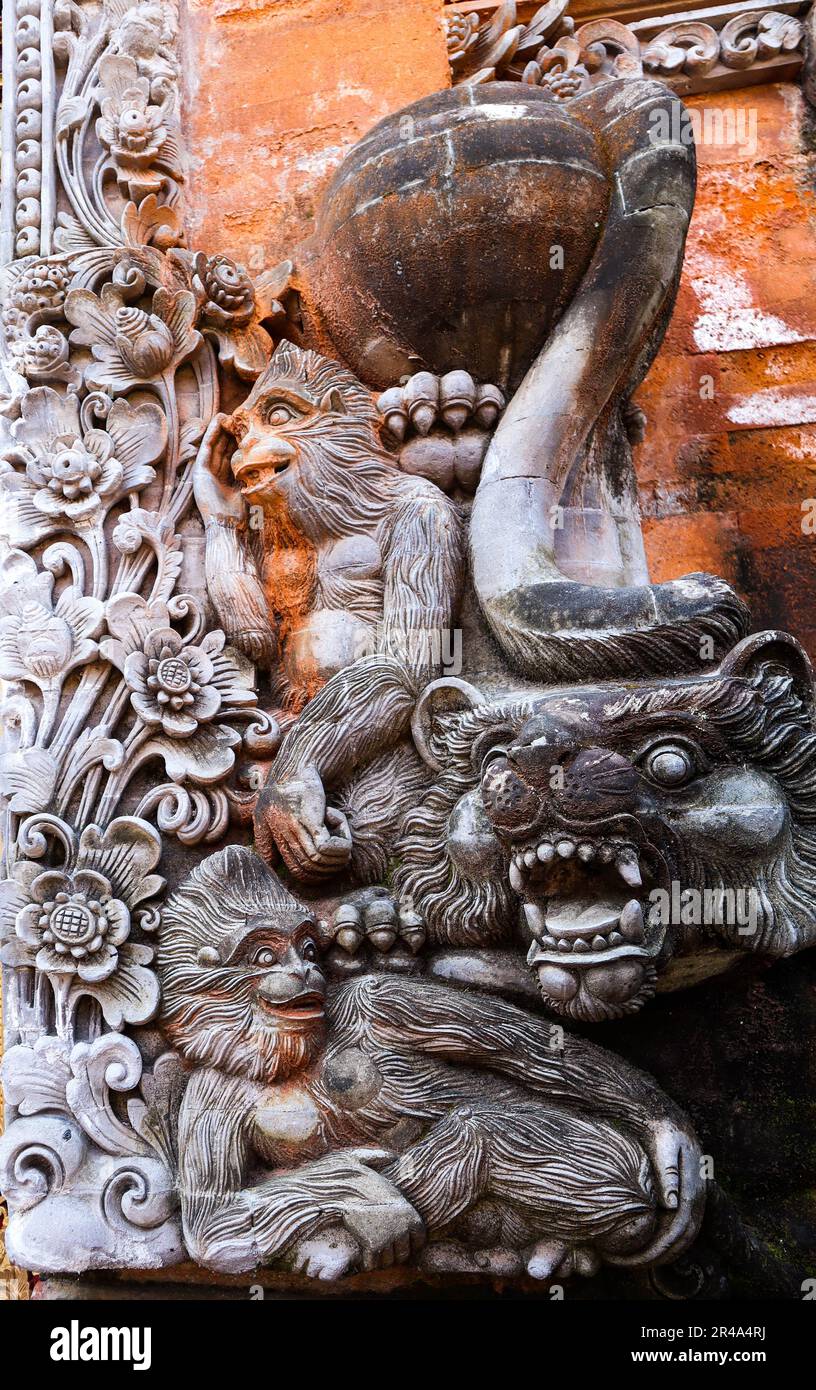 A two-headed lion and snake statue with intricate detail in Ubud, Bali ...