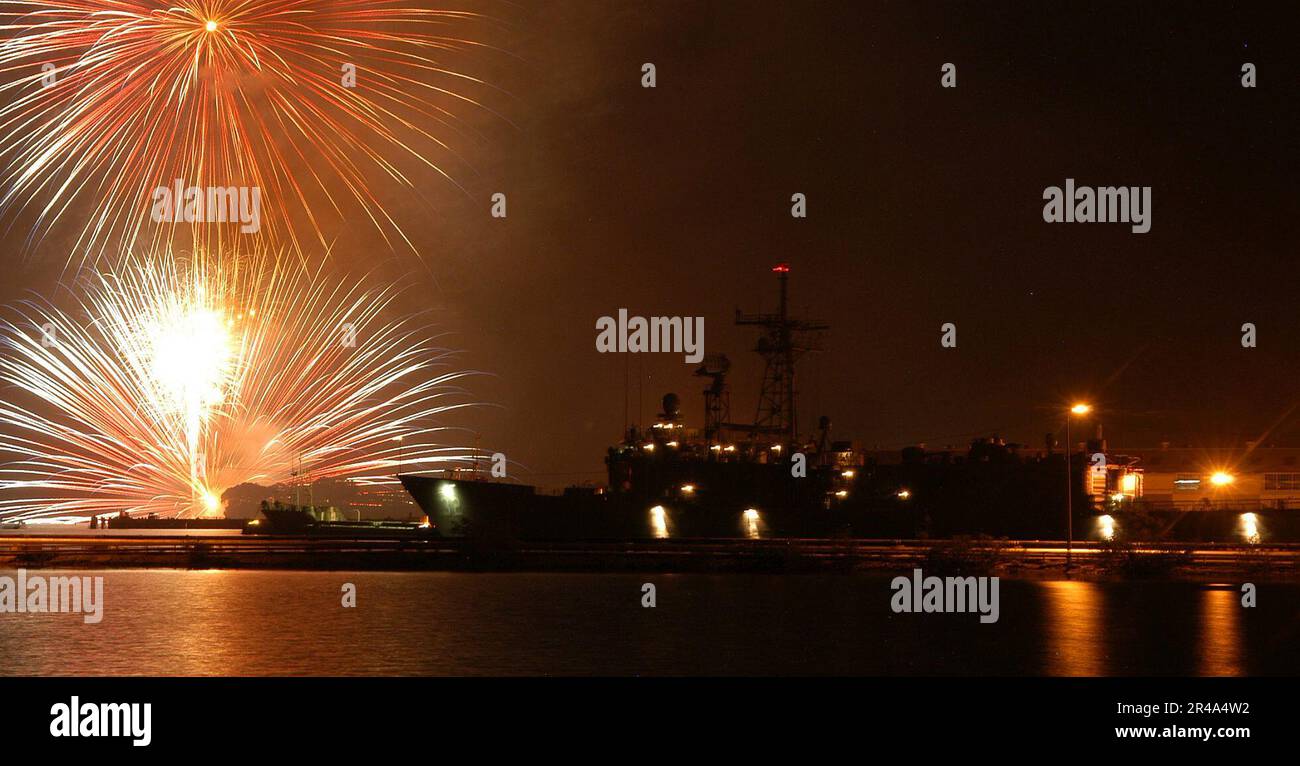 US Navy Fireworks explode above the guided missile frigate USS John L ...