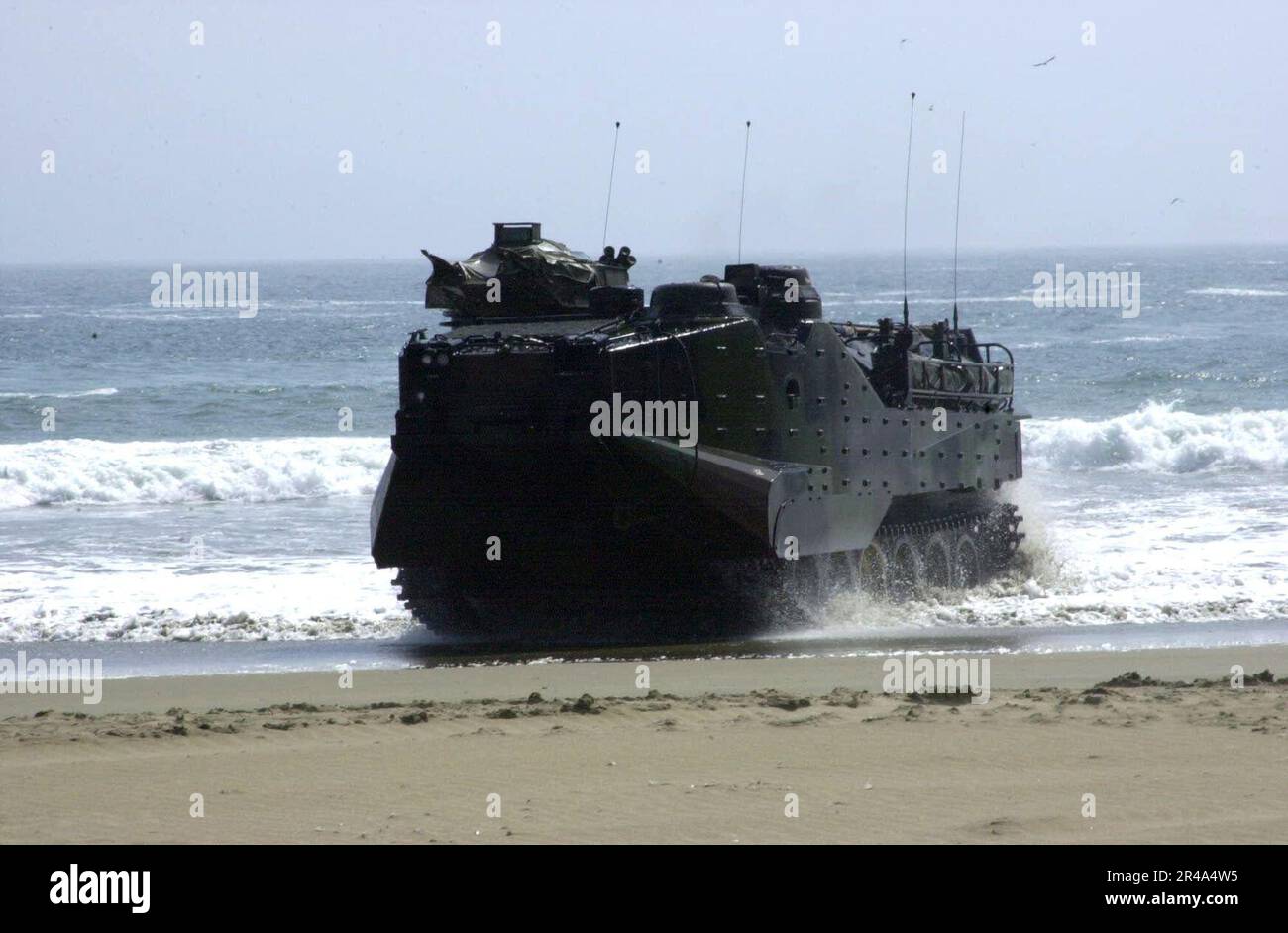 US Navy An amphibious assault vehicle (AAV) rolls out of the water to ...