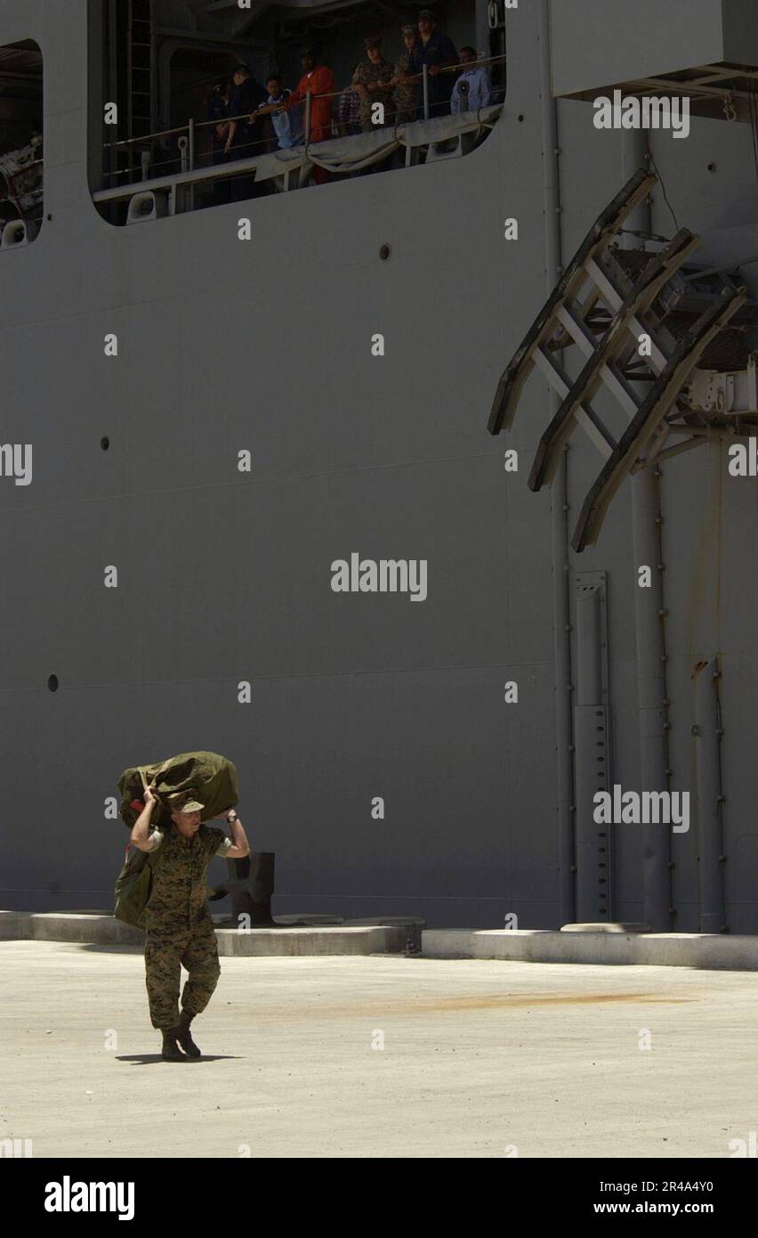US Navy A Marine from the 3rd Battalion, 3rd Marine Regiment carries ...