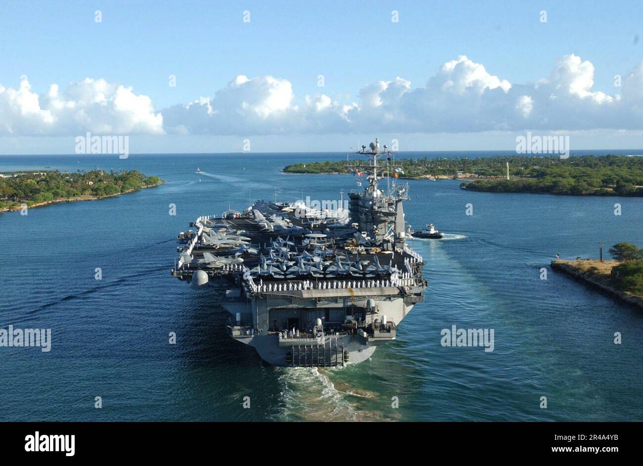 US Navy The Nimitz-class aircraft carrier USS John C. Stennis CVN 74 steams out of Pearl Harbor ...