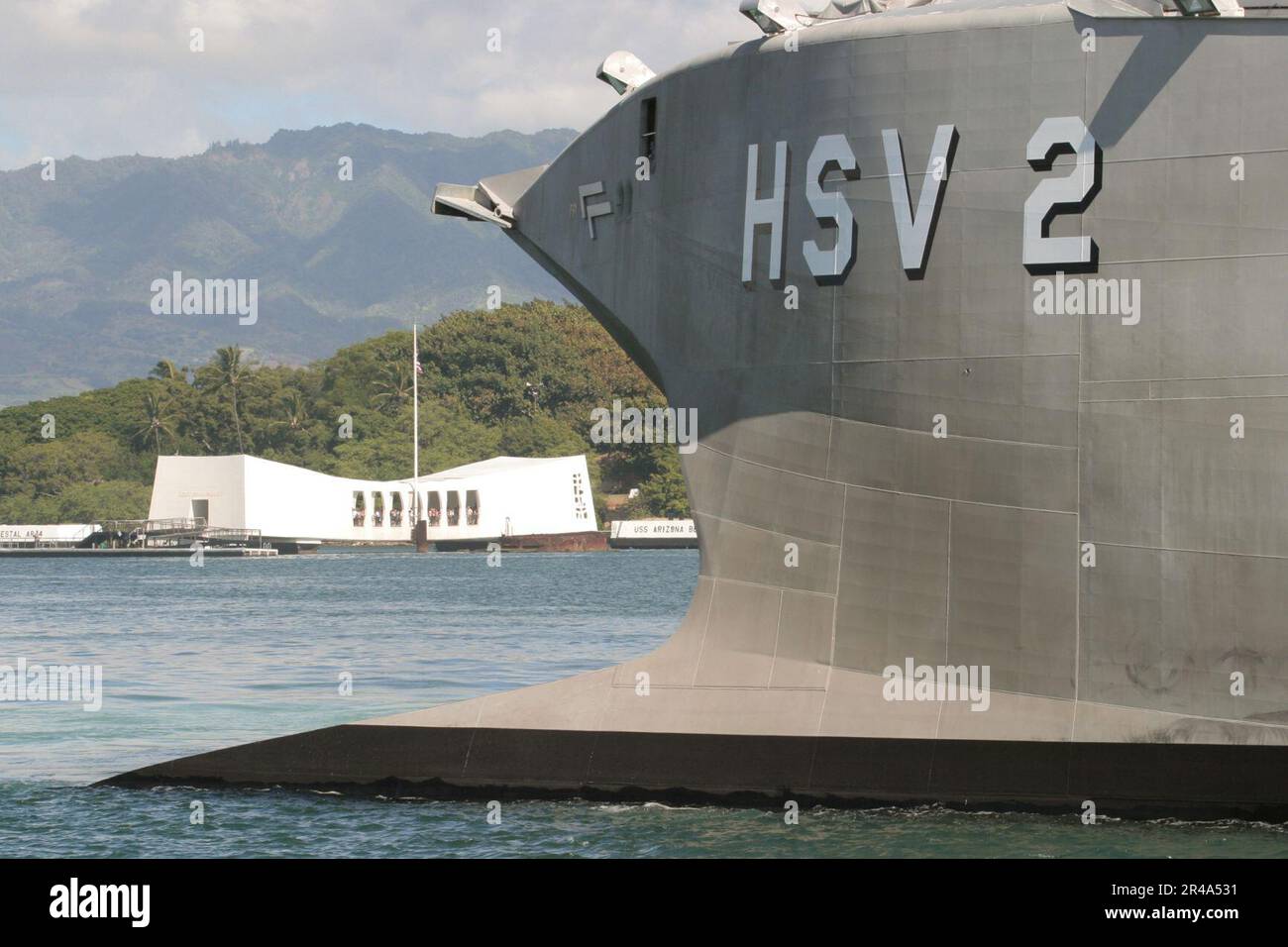 US Navy The bow of High Speed Vessel Two HSV-2 Swift frames the USS ...