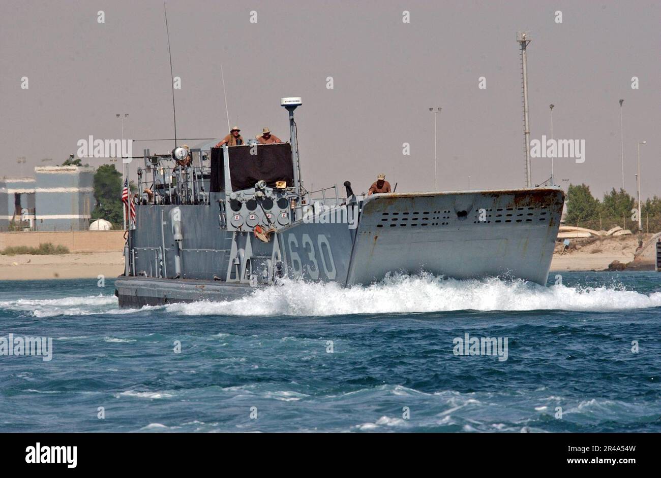 US Navy A Landing Craft Utility (LCU) departs the beach while ...