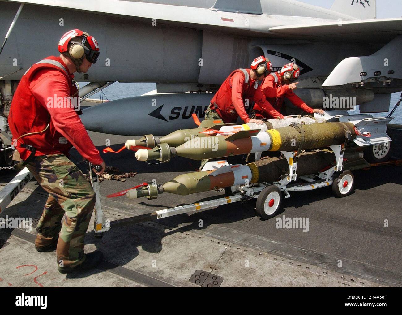 US Navy Aviation Ordnancemen assigned to the Sunliners of Strike Fighter Squadron Eight One (VFA ...