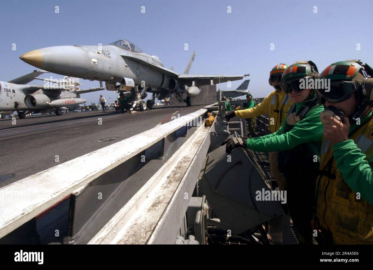 US Navy Aviation Boatswains Mate's signal that an F-A-18 Hornet ...
