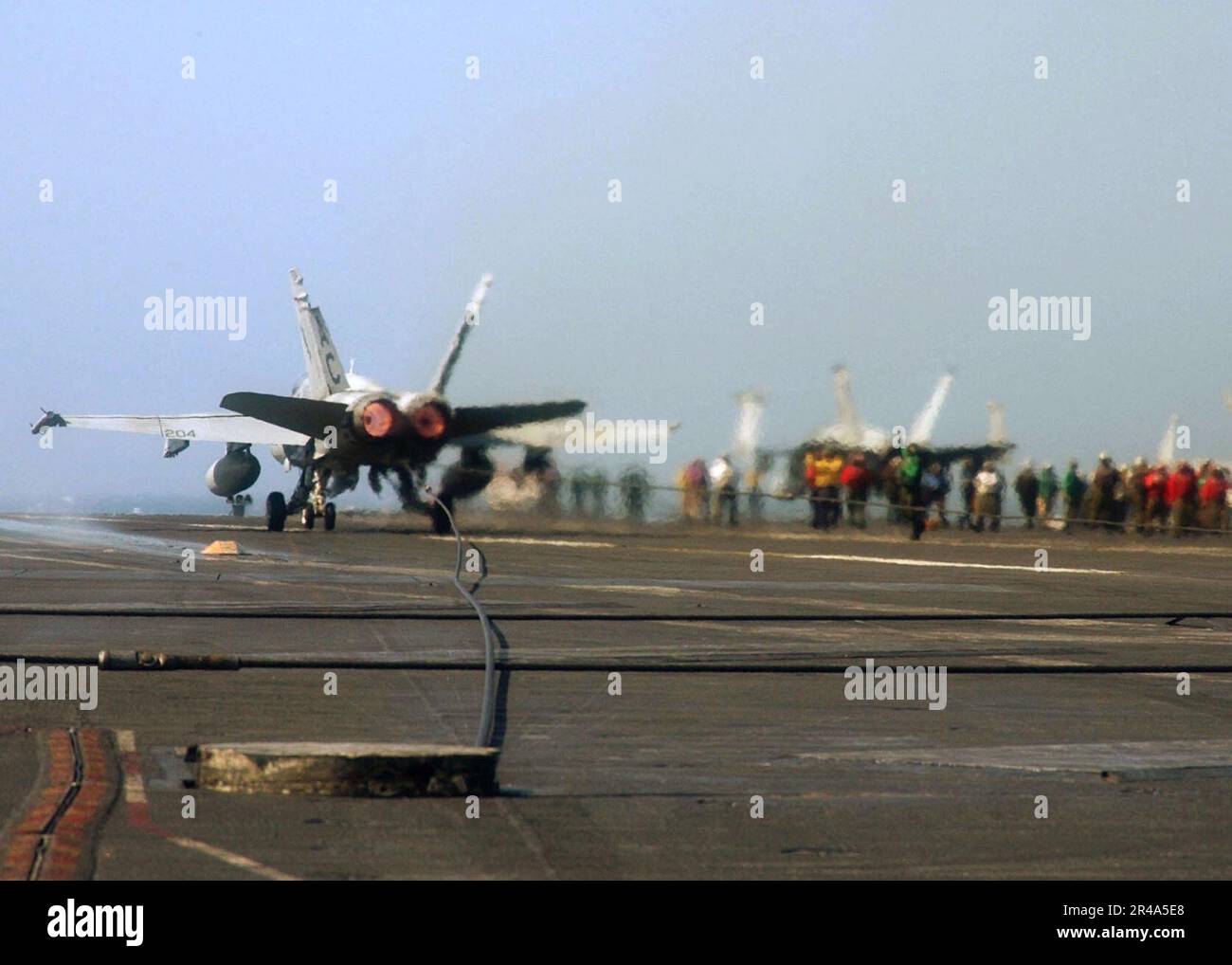 US Navy An F-A-18 Hornet assigned to the Gunslingers of Strike Fighter ...