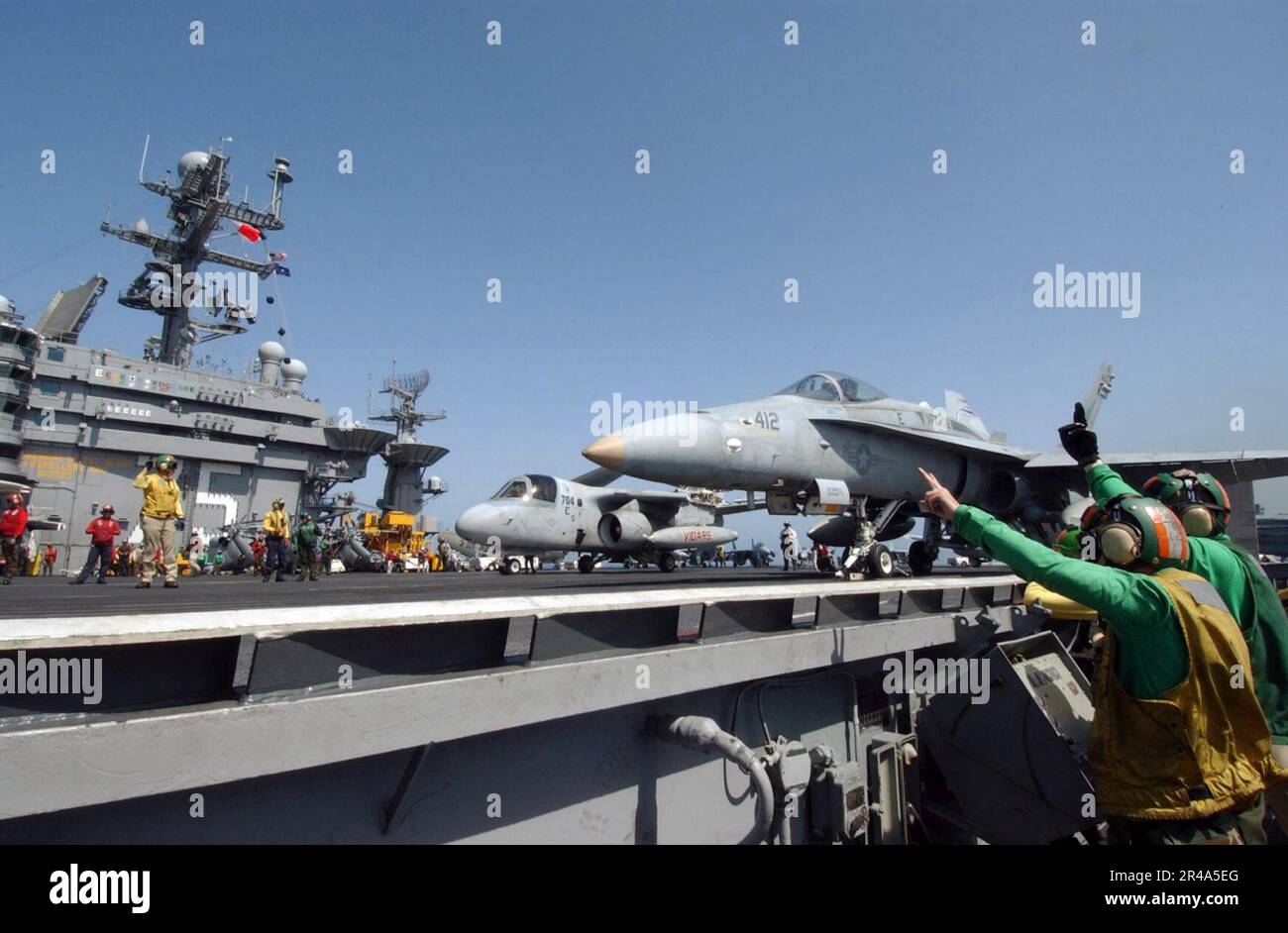 US Navy Aviation Boatswains Mate's signal that an F-A-18 Hornet ...