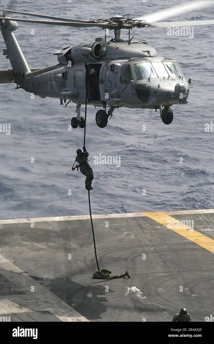 US Navy A member of Explosive Ordnance Disposal (EOD) mobile unit 2 ...