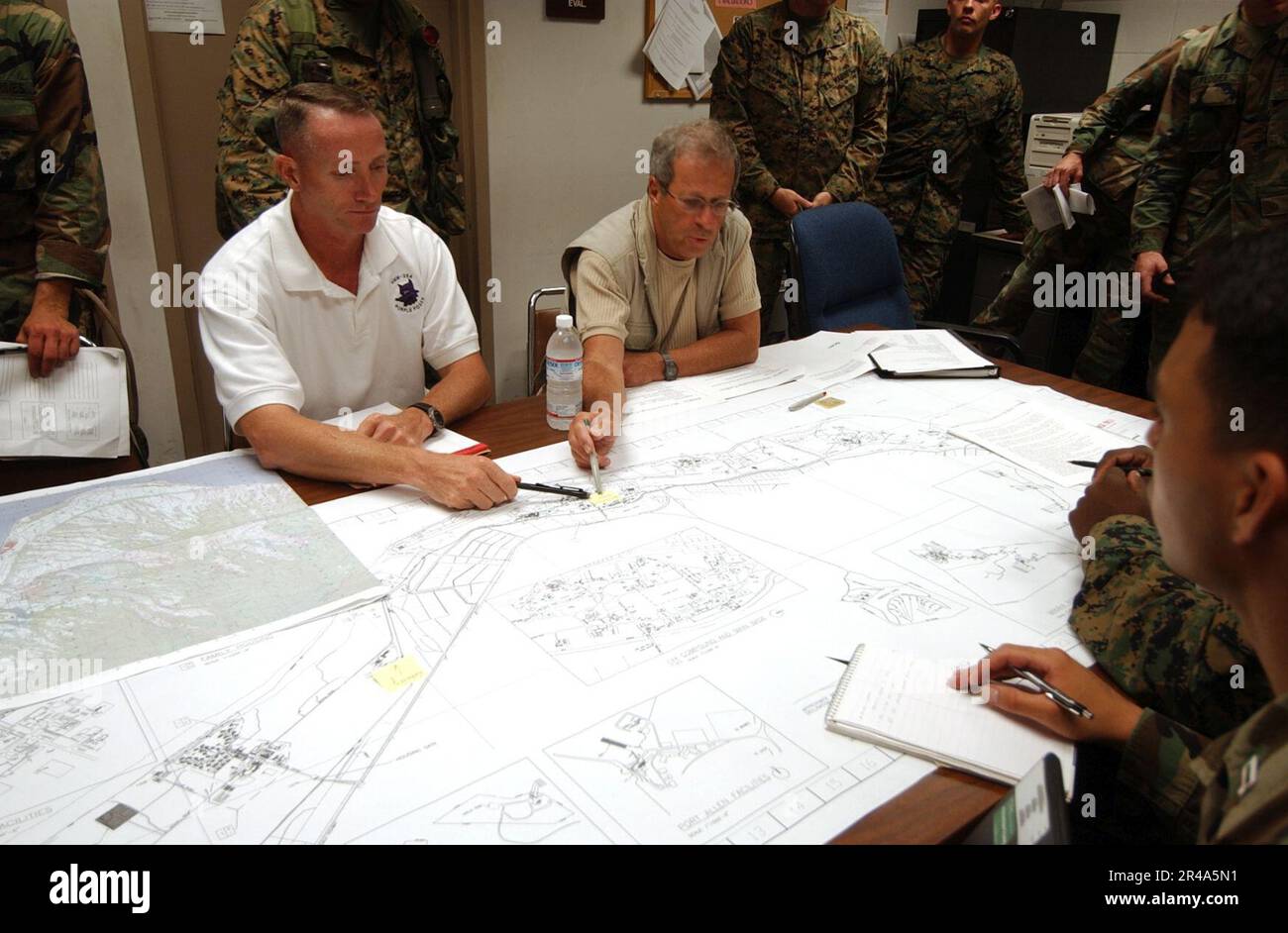 US Navy Mr. Edward Marks, seated, center, role playing as Ambassador ...