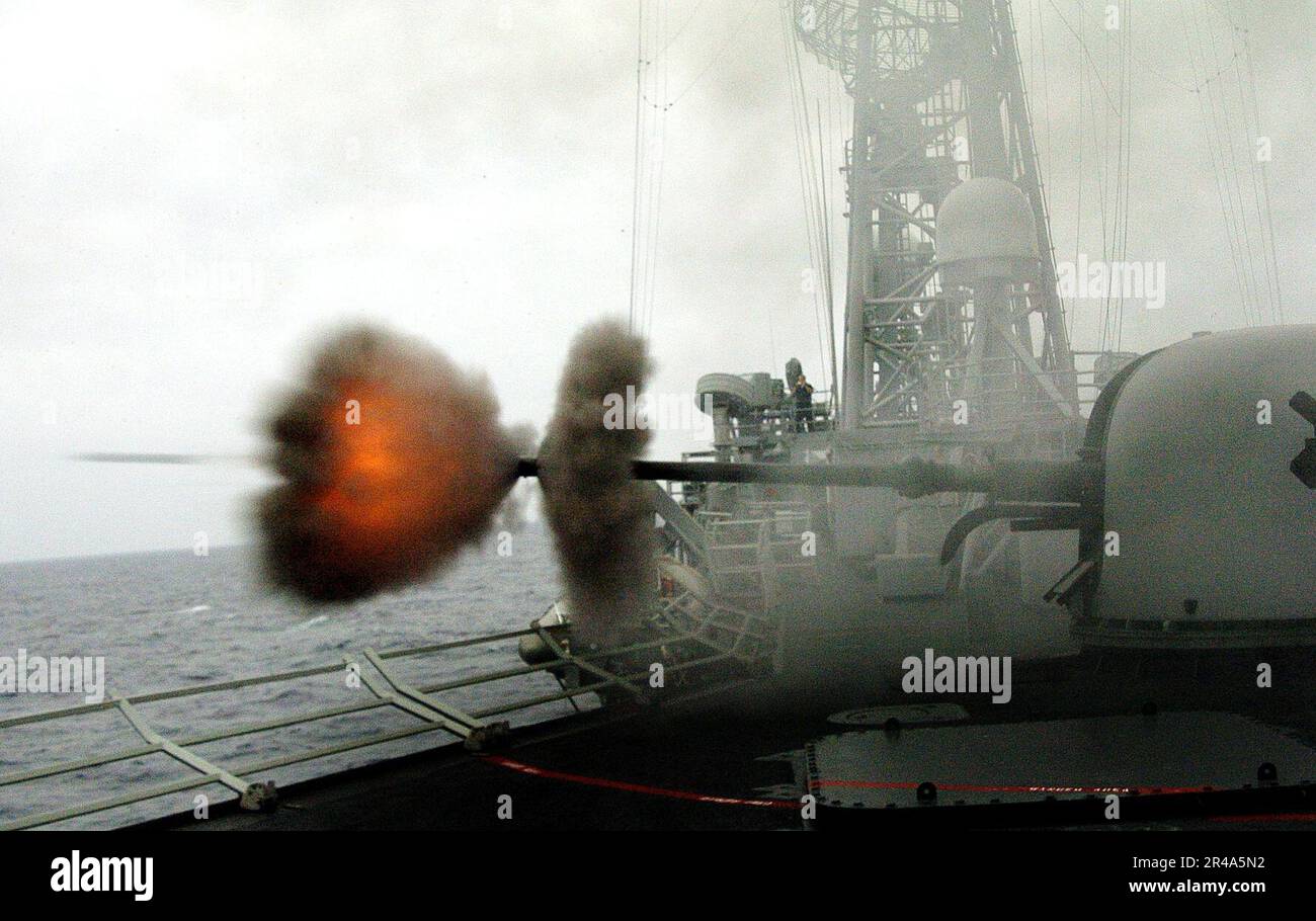US Navy A round is fired from the ship's MK-75 76mm gun aboard the ...