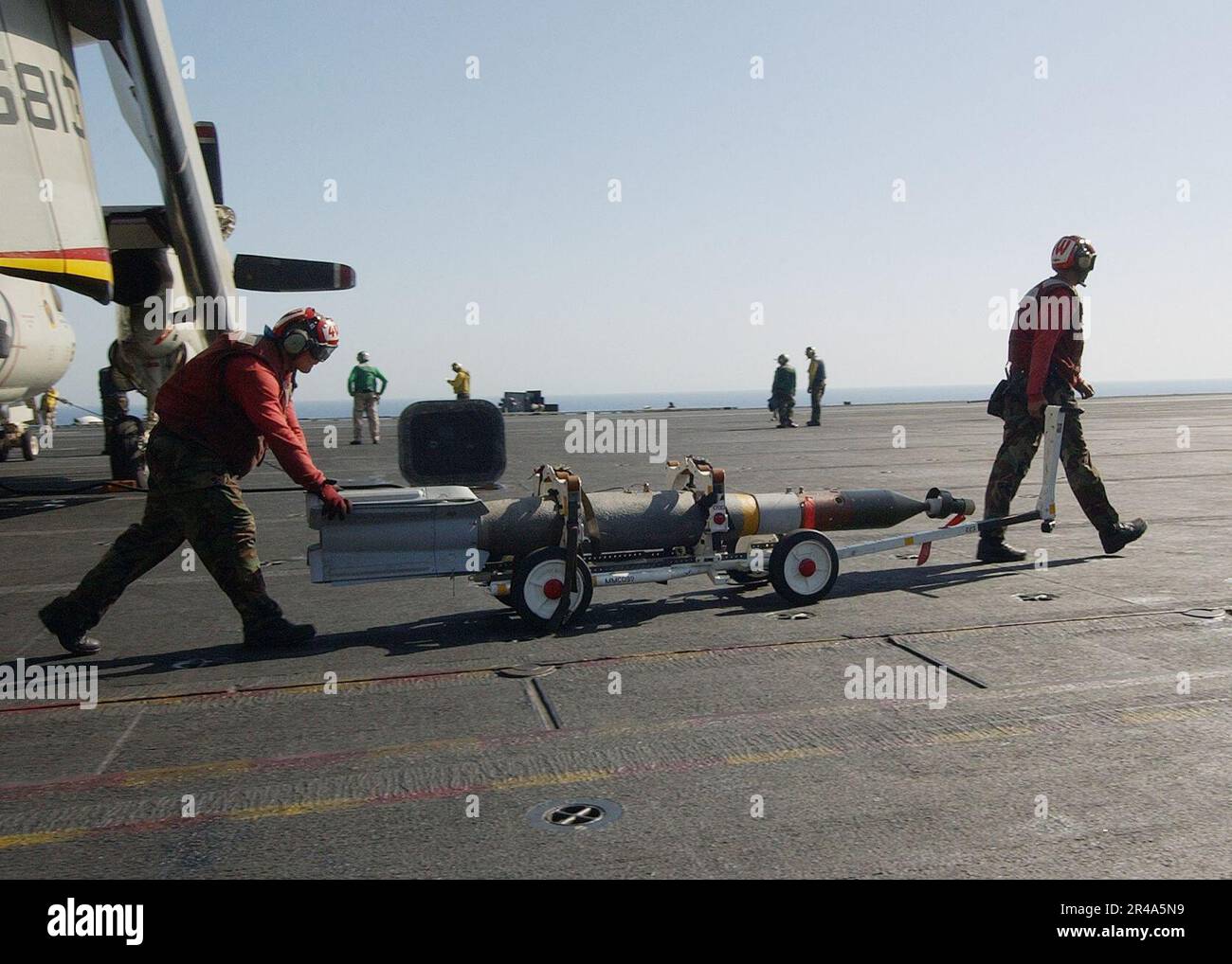 US Navy Aviation Ordnancemen transfer Guided Bomb Unit Twelve (GBU-12 ...