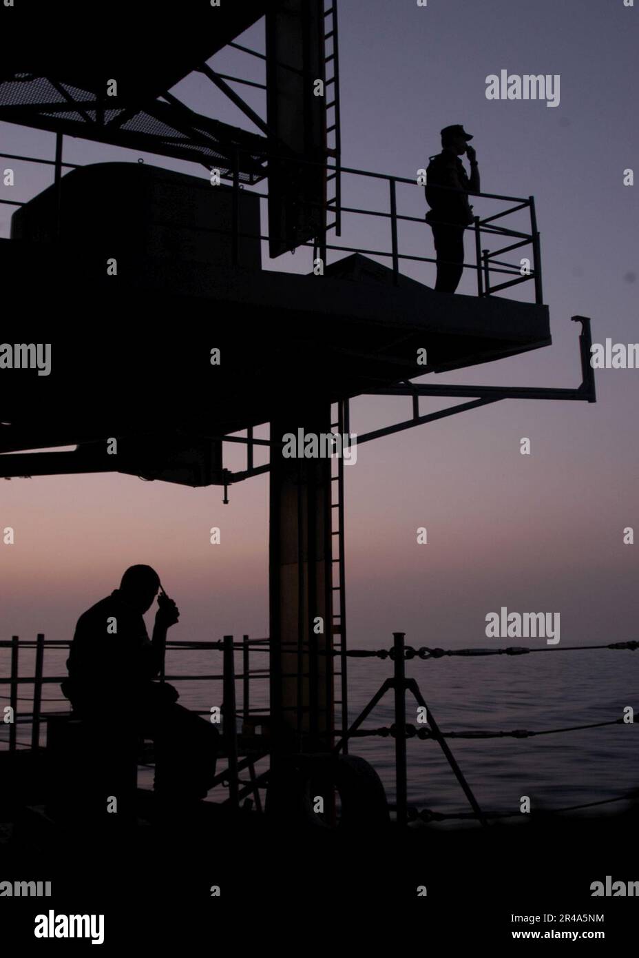 US Navy As the sun sets two Sailors stand the fantail lookout watch ...