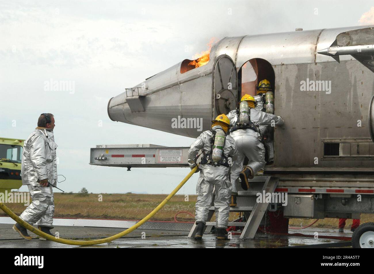 US Navy Firefighters extinguish a fire on the Mobile Aircraft ...