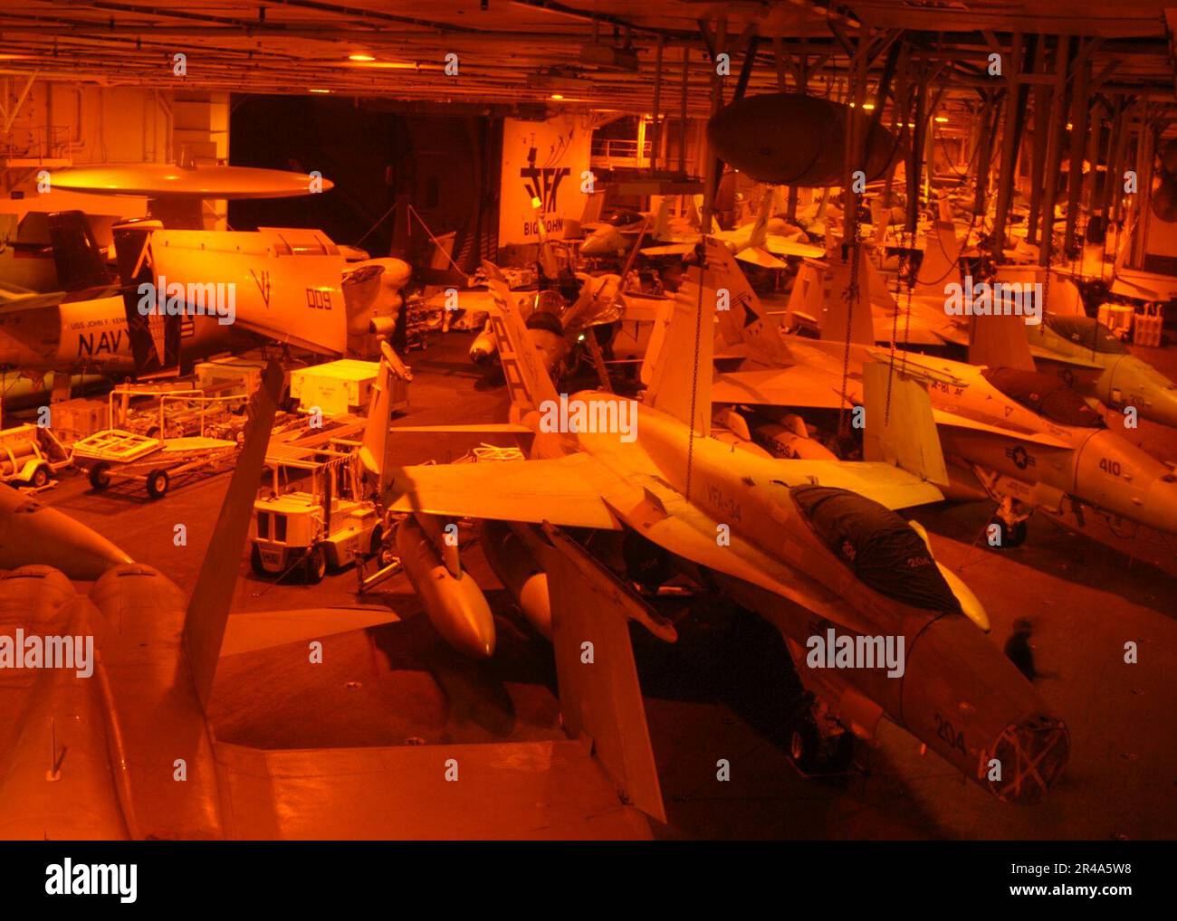 US Navy Sailors work throughout the night performing routine ...