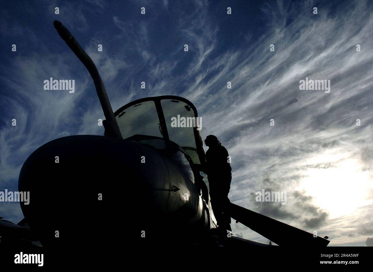 US Navy A plane captain conducts a daily turn around inspection on an ...