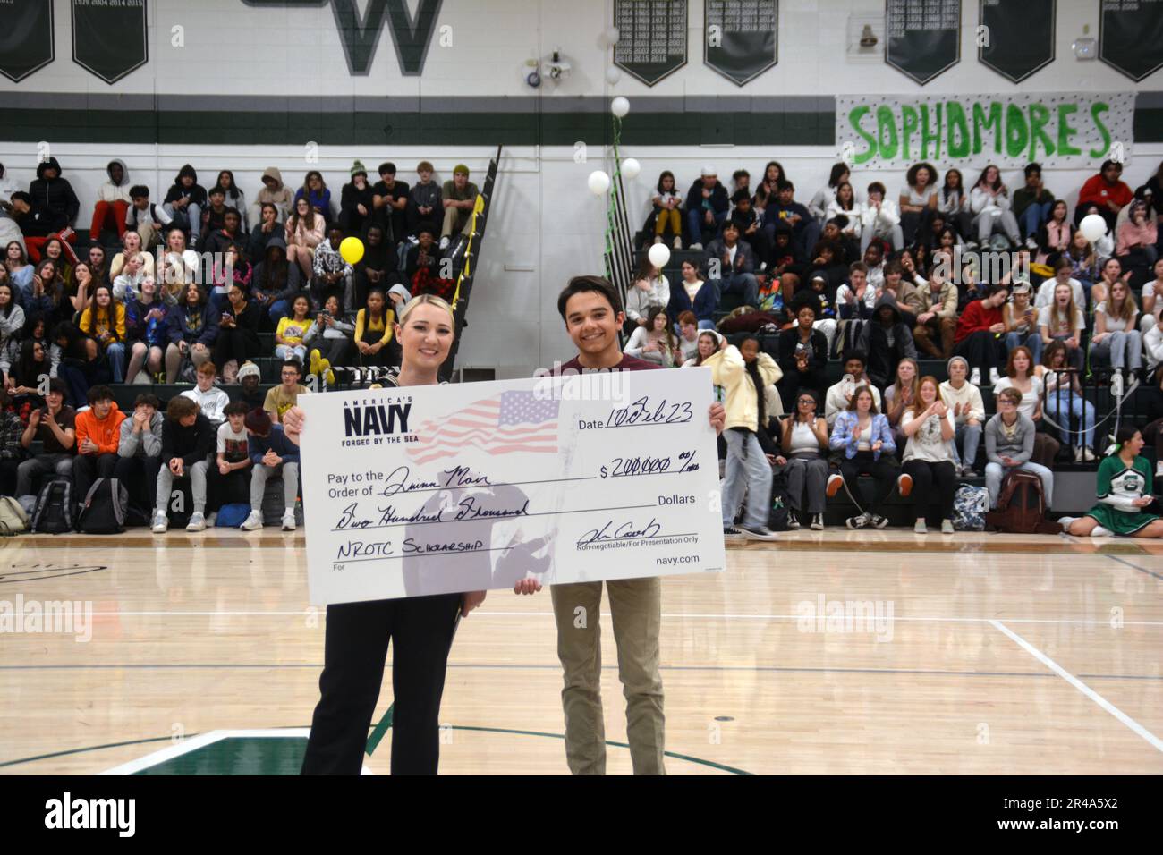 Petty Officer First Class Shelbi Lowe presents the NROTC Check to Quinn ...