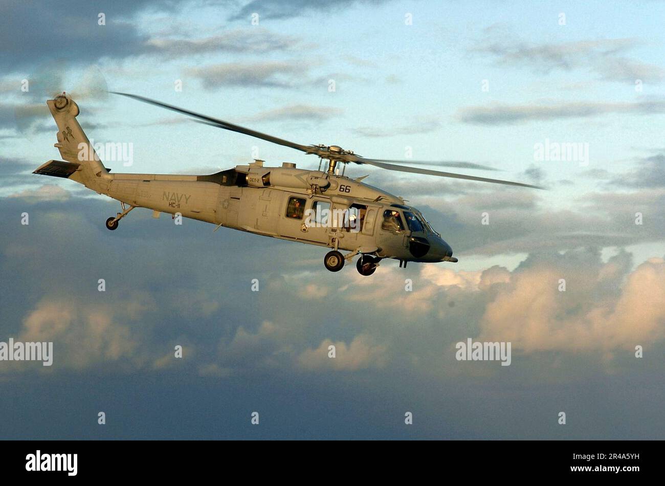 US Navy An MH-60S Knighthawk assigned to the Gun Bearers of Helicopter ...