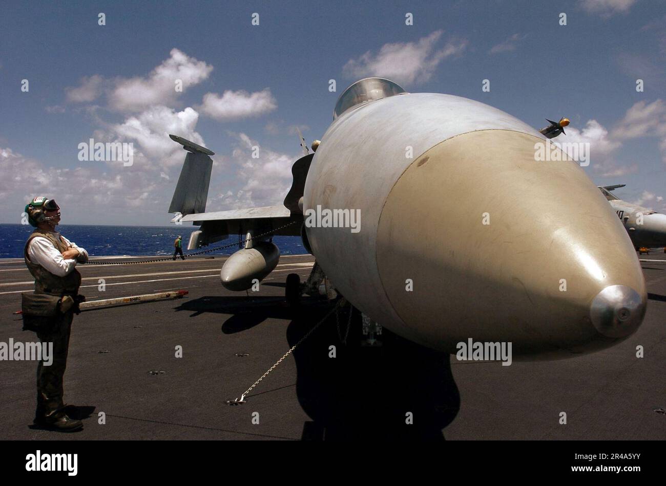 US Navy A Final Checker communicates with the pilot of an F-A-18E Super ...