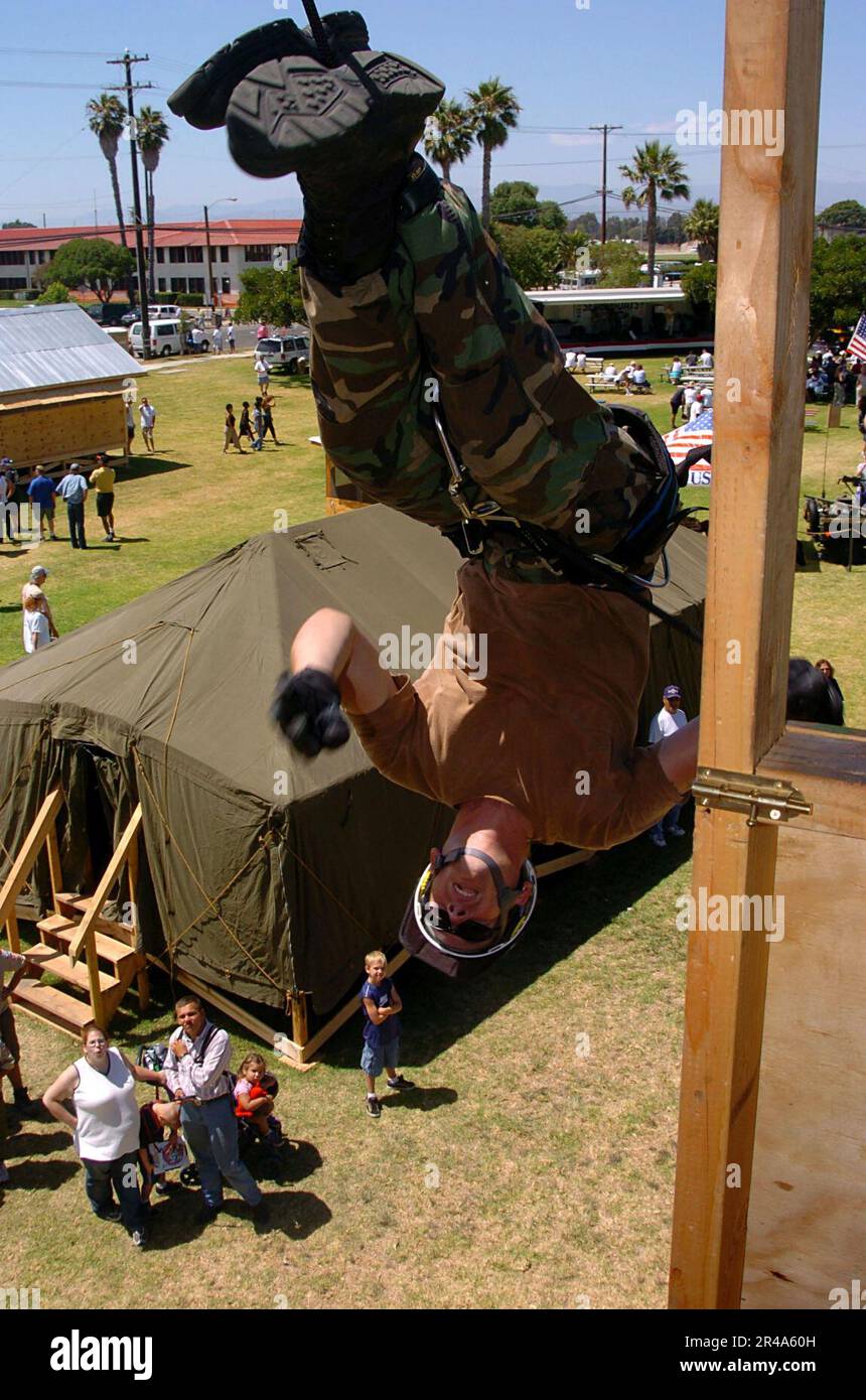 US Navy Utilitiesman 1st Class displays different repelling techniques ...