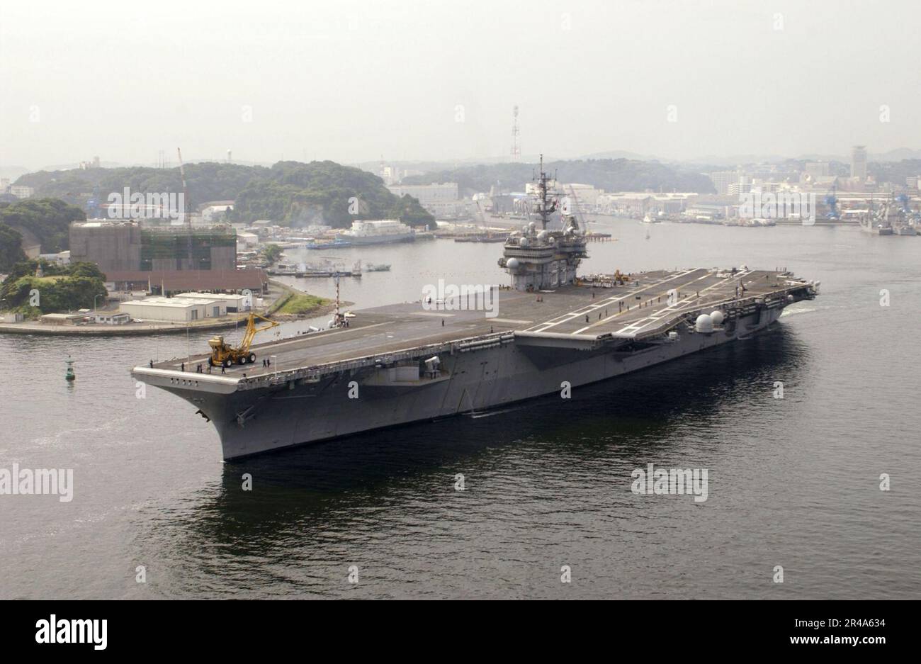 US Navy USS Kitty Hawk (CV 63) departs Yokosuka Naval Base Stock Photo ...