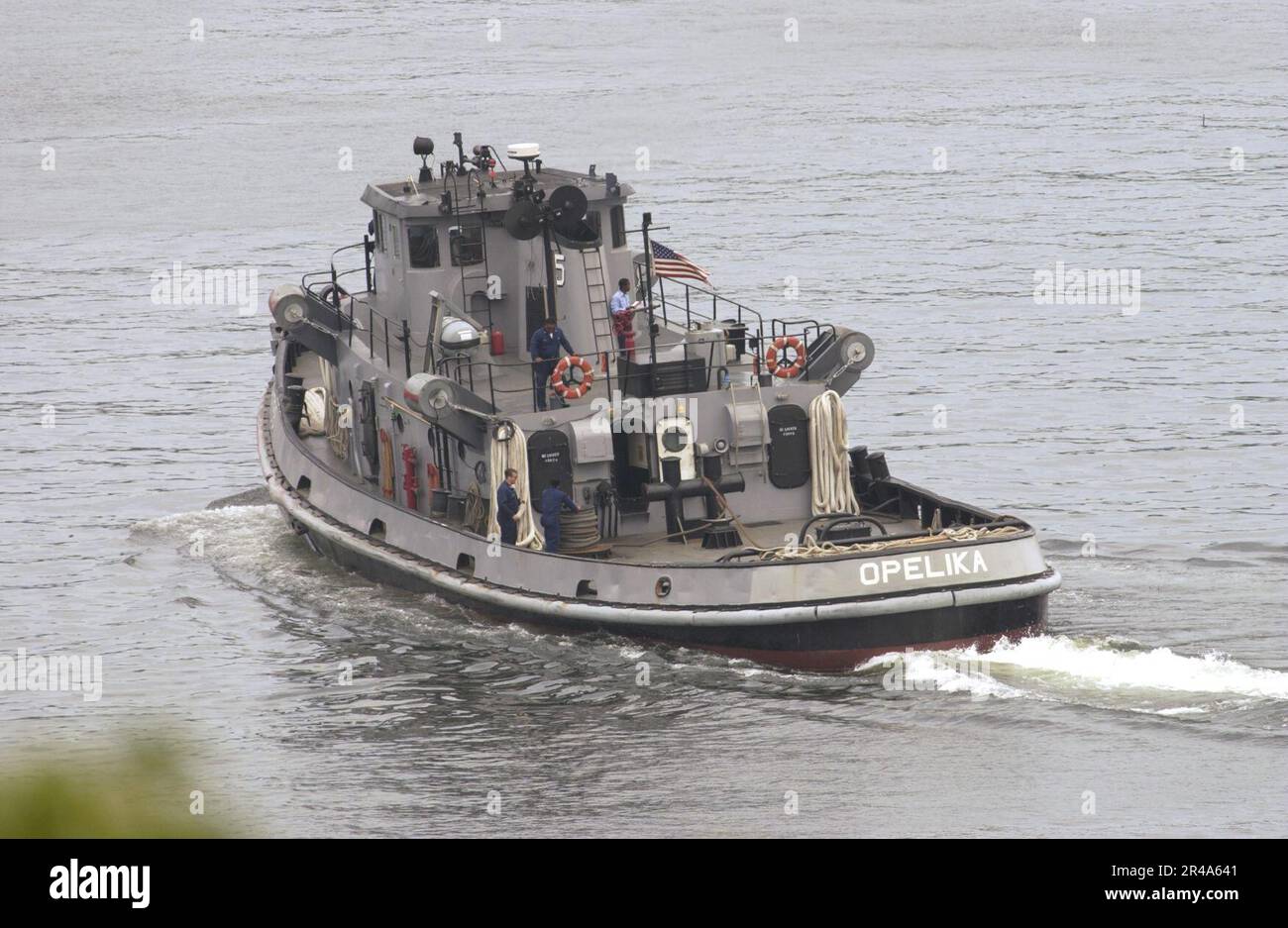 US Navy Harbor tug USS Opelika (YTB 798) gets underway to assist in ...